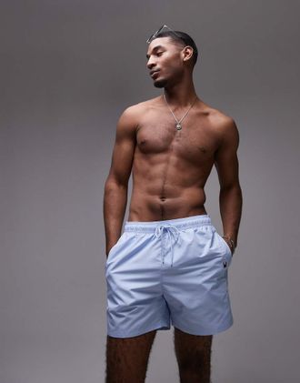 Tommy Hilfiger Pastellblaue Badeshorts mit seitlichem Logo und Kordelzug