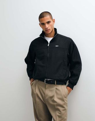 Obey veste de surv&ecirc;tement ajust&eacute;e &agrave; demi-zip noire avec logo