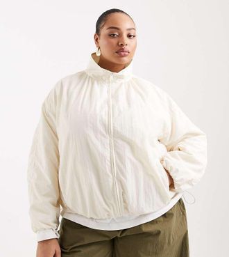 Asos Curve ASOS DESIGN Curve - Veste de surv&ecirc;tement oversize &agrave; ourlet bouffant - Blanc cass&eacute;
