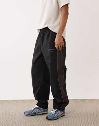 New Balance Trackside - Pantalon - Noir