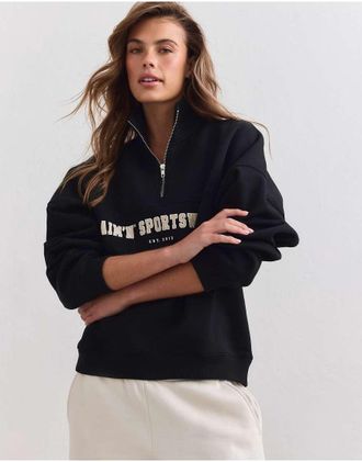 Aim'n sweat varsity noir &agrave; demi-zip noir