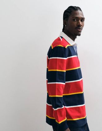 Tommy Jeans Polo ray&eacute; &agrave; logo badge - Rouge/bleu marine