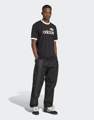 adidas Originals Pantalon tendance &agrave; empi&egrave;cements en tulle et fermetures &eacute;clair - Noir