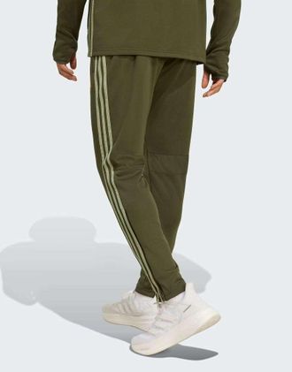 adidas adidas Performance - Tiro 25 Essentials - Winterfeste Trainingshose in Night Cargo/Tent Green/Imp-Gr&uuml;n
