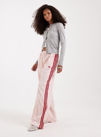 adidas Originals Firebird - Pantalon de surv&ecirc;tement ample en nylon - Rose et rouge