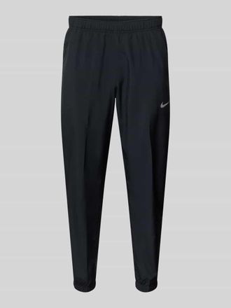 Nike Form Pants mit Logo-Print und Eingriffatschen