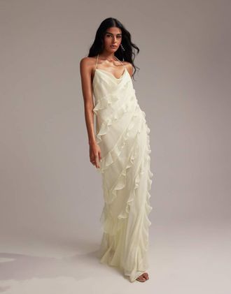 Asos Linvitée - Robe longue coupée en biais avec bretelles fines et volants - Jaune pâle