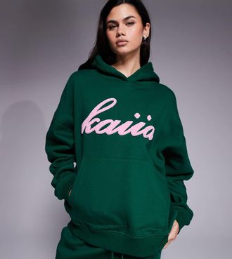 KAIIA Exclusivit&eacute; - Kaiia - Sweat &agrave; capuche densemble oversize riche en coton avec logo en imitation peau de mouton - Vert et rose