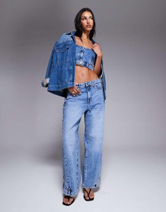 Good American Reworked - Weit geschnittene Jeans in verwaschenem Hellblau, Kombiteil