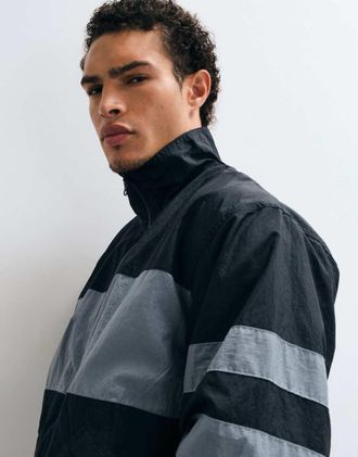 NIKE SPORTWEAR Premier i96 Trainingsjacke in Schwarz und Grau