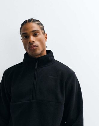 Gramicci Thermo-Fleece-Sweatshirt mit Viertelrei&szlig;verschluss in Schwarz