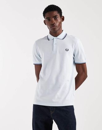 Fred Perry Polohemd in leuchtendem Blau mit doppelten Zierstreifen und Logo