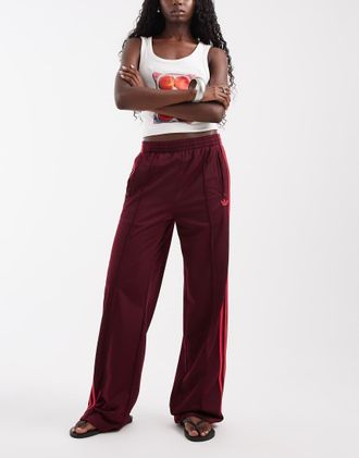 adidas Originals Firebird Trainingshose in Burgunderrot und Pink