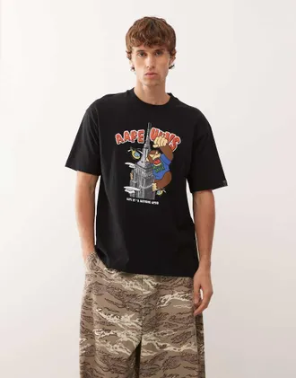 Aape By A Bathing Ape Aape by A Bathing Ape - T-shirt coupe carrée avec imprimé bâtiment sur le devant - Noir