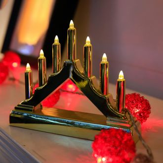 Hellum Hellum, LED-Kerzenleuchter, Schwibbogen, Kunststoff, Gold, 7 warm-weiße LEDs, 16x13 cm, Indoor, batteriebetrieben (2AA), Weihnachts-Dekoration, 520965