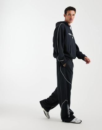 New Balance Pantalon de surv&ecirc;tement en tissu &eacute;ponge - Noir