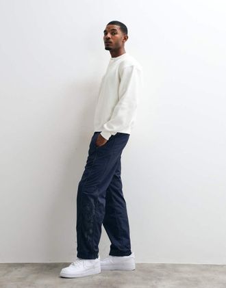 Hollister pantalon de surv&ecirc;tement ample &agrave; motif lat&eacute;ral bleu marine