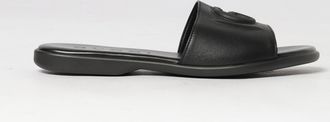 Gucci Claquettes en cuir de veau avec monogramme GG en relief