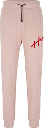 HUGO BOSS Herren Drog Jogginghose aus Baumwoll-Terry mit handgeschriebener Logo-Stickerei Hellrosa XS
