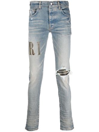 Amiri jean skinny imprim&eacute; &agrave; effet us&eacute; - Bleu
