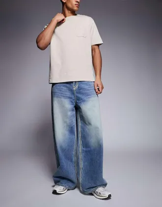 True Religion Mikey - Superweite Jeans in verwaschenem Blau mit Pattentasche