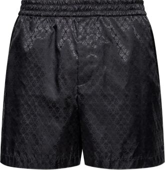 Alexander McQueen short &agrave; motif t&ecirc;te de mort - Noir