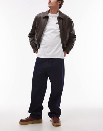 Carhartt Work in Progress Landon - Schmal zulaufende Jeans in Dunkelblau mit lockerem Schnitt-Marineblau