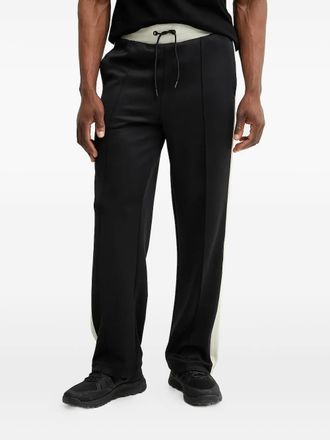 Guess Co pantalon de jogging à rayures latérales - Noir