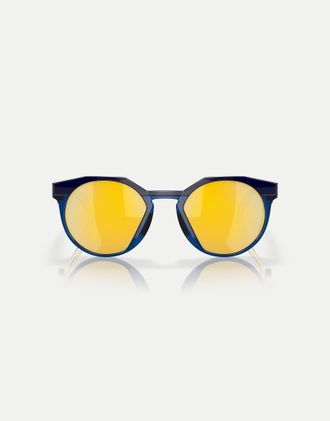 Oakley Kylian Mbappé Signature Series Hstn - Lunettes de soleil rondes à verres polarisés dorés effet miroir - Bleu marine/bleu transparent