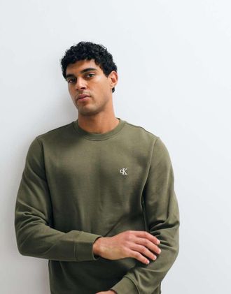 Calvin Klein Jeans sweat-shirt &agrave; manches longues et col rond Terry Monogram kaki-Vert