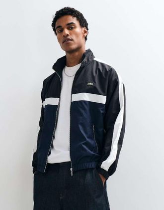 Lacoste veste de surv&ecirc;tement color block d&eacute;perlante marine-bleu marine