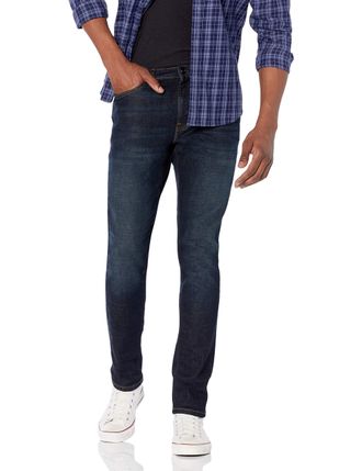 Amazon Essentials Herren Stretchjeans, Skinny-Passform - Auslauffarben, Dunkles Indigo/Leicht Ausgesp&uuml;lt, 34W / 32L