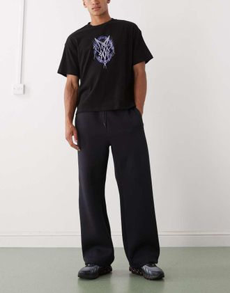 Weekday Pantalon de jogging ample en tissu effet n&eacute;opr&egrave;ne - Bleu marine fonc&eacute;