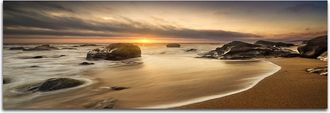 Paul Sinus Art Panoramabild auf Leinwand und Keilrahmen 150x50cm Meer Strand Steine Sonnenaufgang Wolken