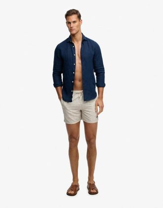 Superdry Short de bain 15 pouces &agrave; imprim&eacute; g&eacute;om&eacute;trique de qualit&eacute; sup&eacute;rieure - Blanc/bleu
