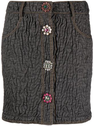 Moschino jupe courte &agrave; boutons fleur - Noir