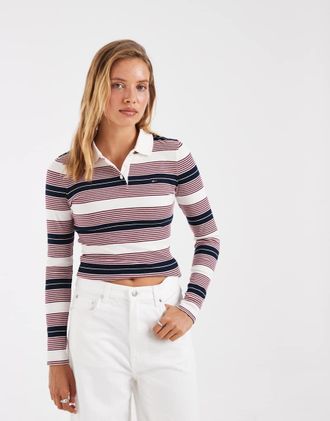 Tommy Jeans Polo ajust&eacute; &agrave; manches longues et rayures avec logo drapeau - Blanc/rose