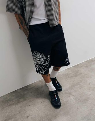 True Religion Shorts aus Fleece mit Tiger-Grafik und Schriftzug in Schwarz in lockerer Passform