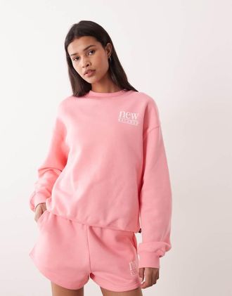 New Balance Reimagined - Sweat ras de cou en polaire - Rose