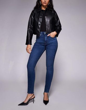 Good American Good Legs - Skinny-Jeans in Mittelblau