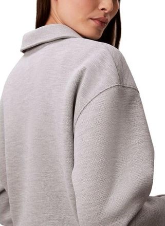 Calvin Klein Pull ample court &agrave; col polo