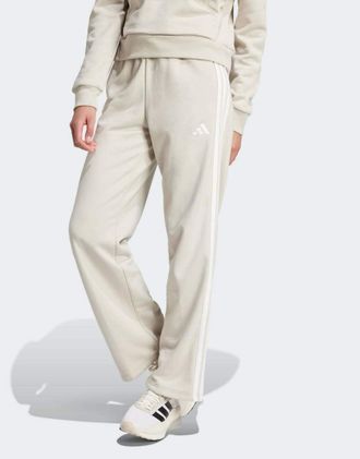 adidas adidas Performance - Essentials - Pantalon en tissu éponge avec ourlet ouvert et logo 3 bandes - Beige/blanc-Neutre