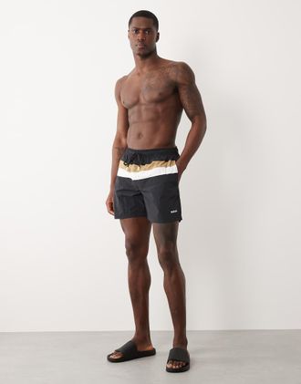 HUGO BOSS BOSS - Louis - Gestreifte Badeshorts in Schwarz