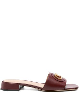 Valentino Garavani mules en cuir à logo V 25 mm - Rouge