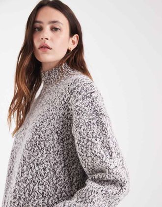 Lacoste Rollkragen-Pullover aus gesprenkelter Wolle in Schwarz und Wei&szlig;-Multi