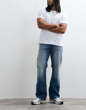 Weekday Mercury Jeans mit lockerer Passform, Bootcut und ausgestelltem Bein in blauer Waschung