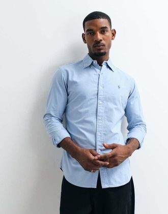Polo Ralph Lauren chemise Oxford slim fit teinte en pi&egrave;ce bleue avec logo icon