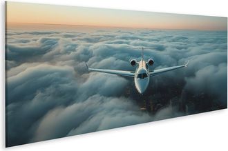 Islandburner Bild auf Leinwand Privatjet fliegt bei Sonnenuntergang &uuml;ber Wolken und Meer Bilder Wandbilder Poster