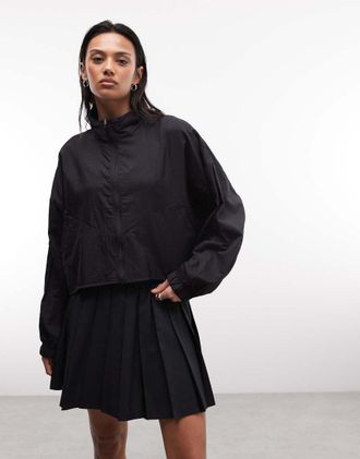 Nike Veste coupe-vent courte &agrave; col chemin&eacute;e - Noir