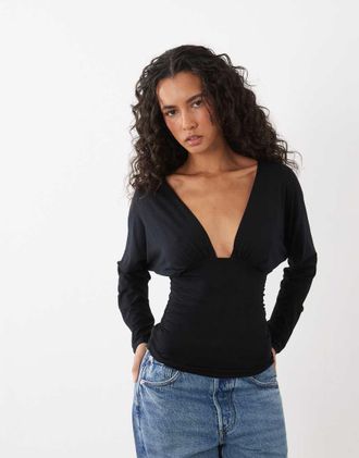 Motel lilro top noir &agrave; d&eacute;collet&eacute; plongeant et manches longues